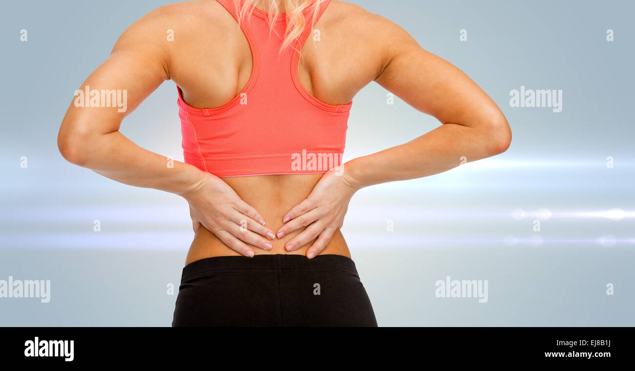 close up of sporty woman touching her back Stock Photo - Alamy