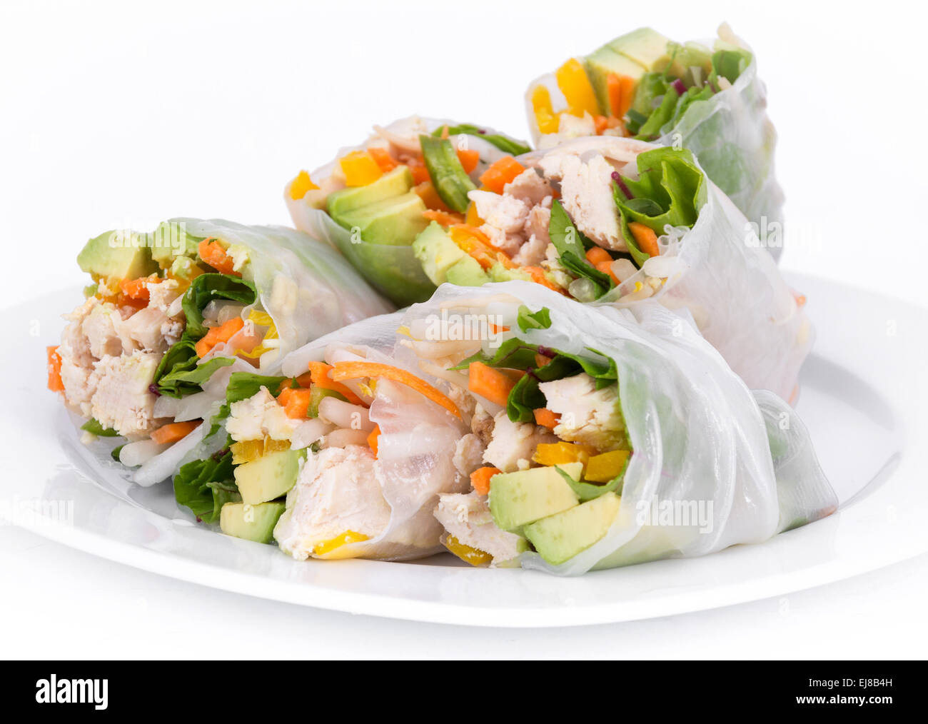 chicken and vegetables spring rolls over white background Stock Photo ...