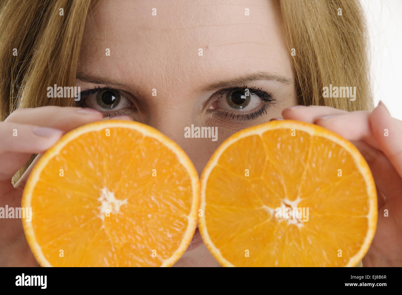 face behind the oranges Stock Photo - Alamy