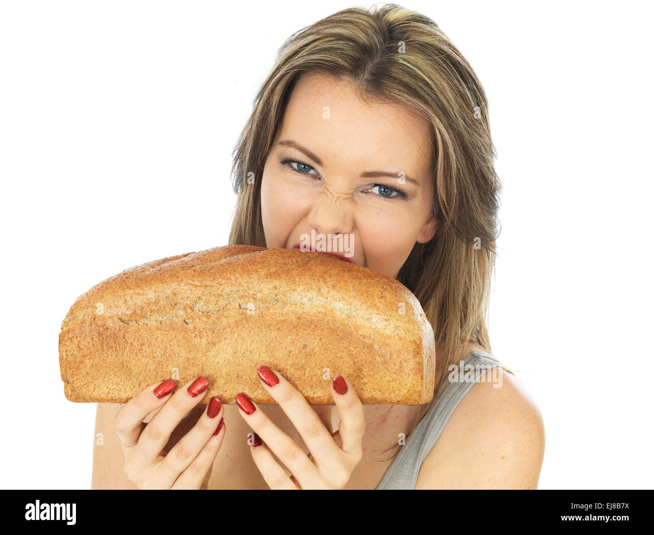 Attractive Young Woman Holding a Loaf of Brown Bread Stock Photo - Alamy