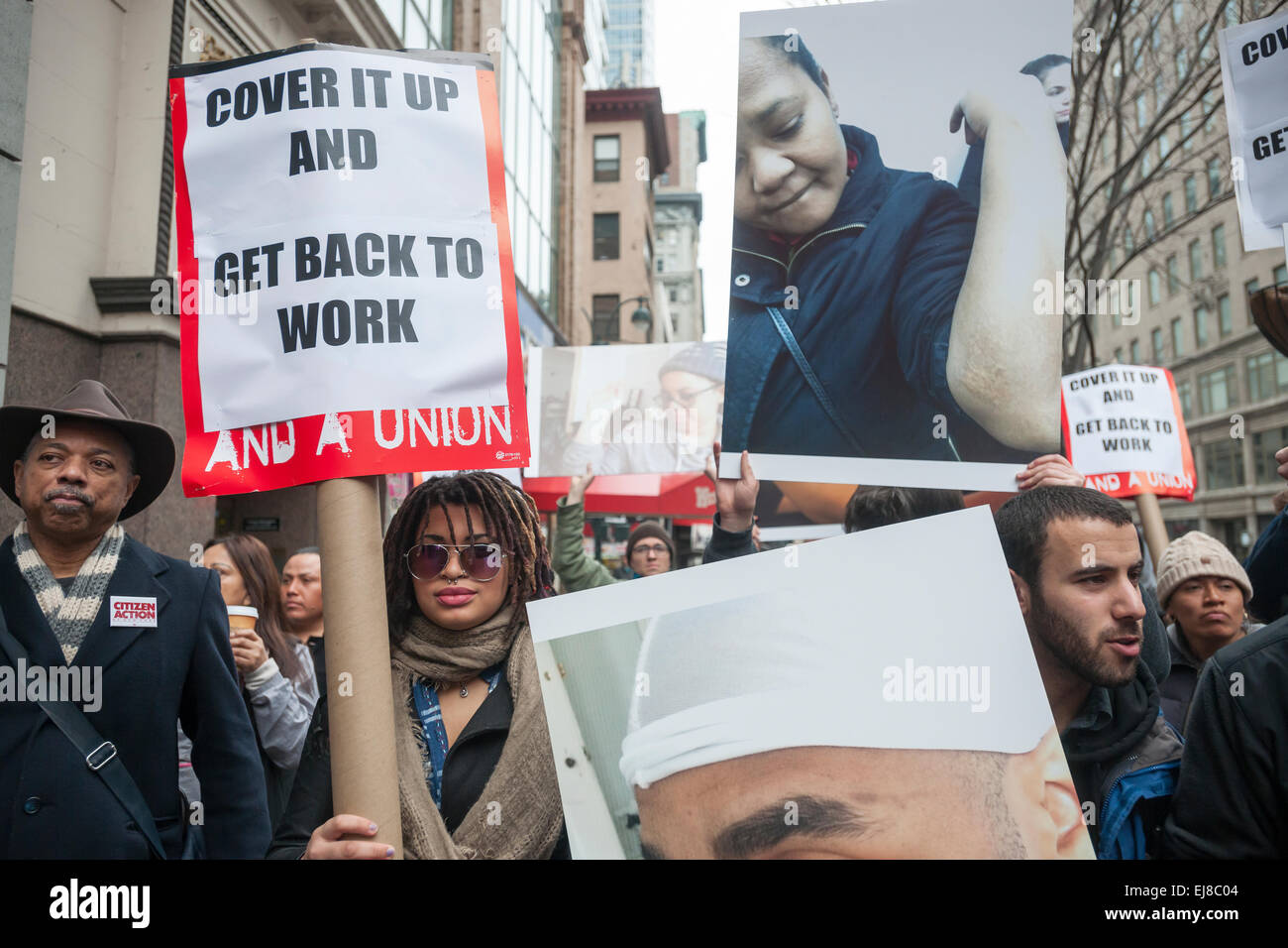 Workers at fast food restaurants and their supporters protest in front ...