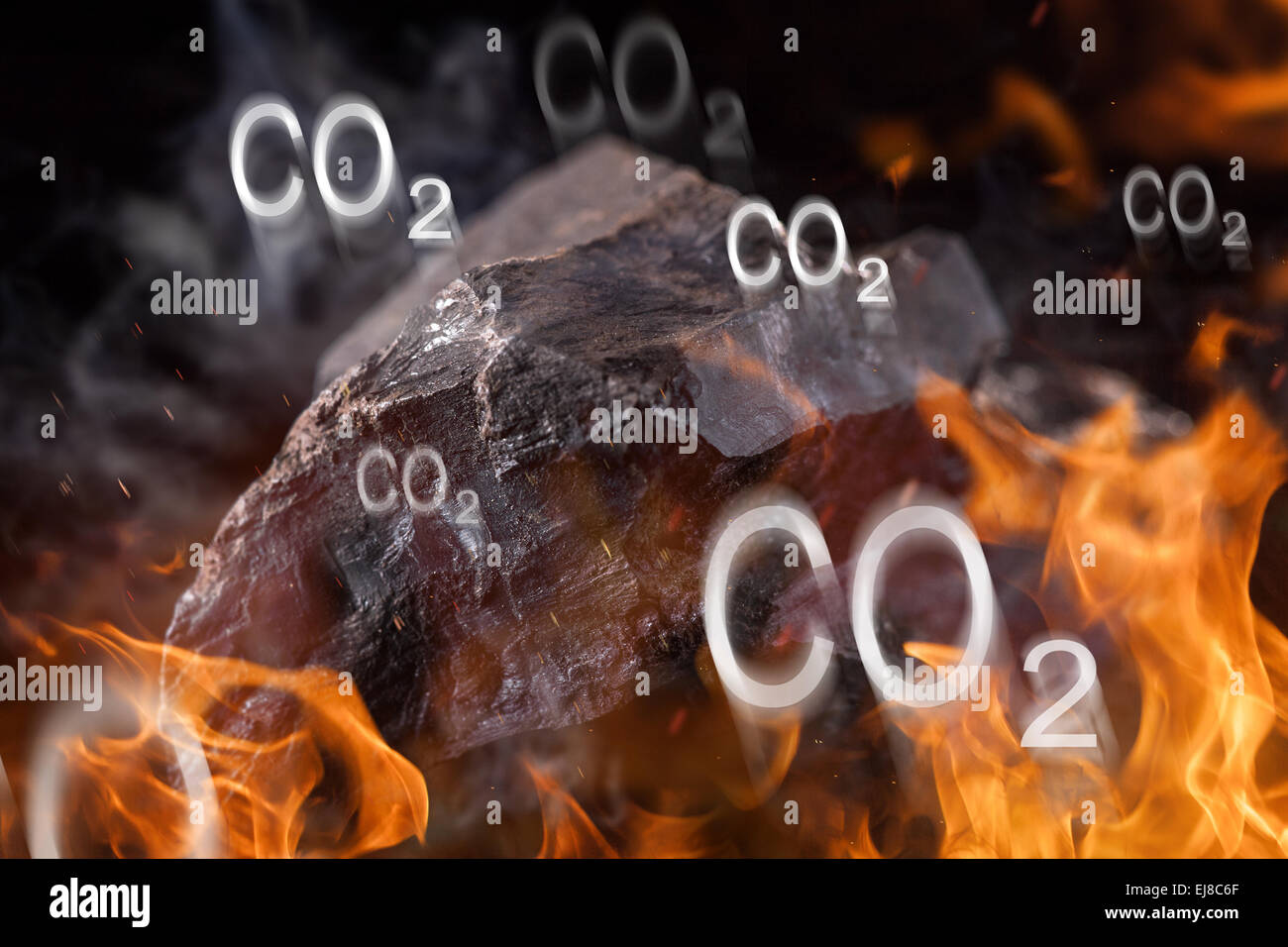 Coal lumps with fire flames on dark background Stock Photo - Alamy