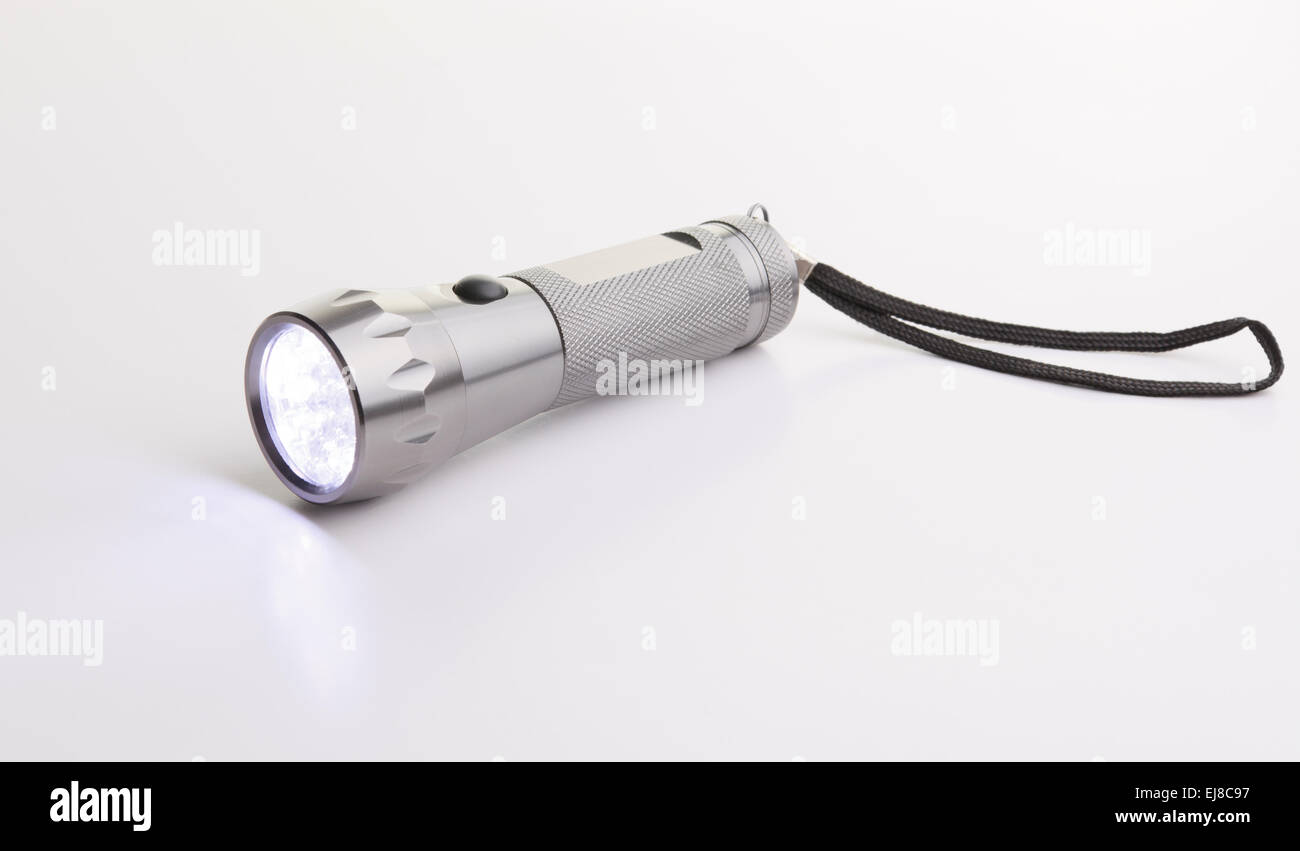 gray flashlight over a gray background on the floor Stock Photo - Alamy