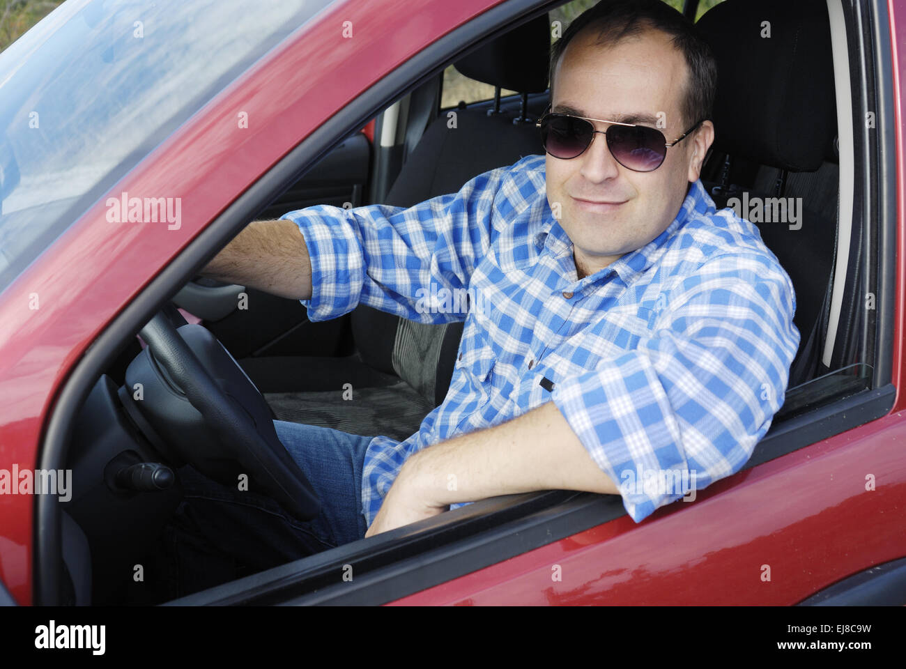 Adult man is driving his car Stock Photo - Alamy