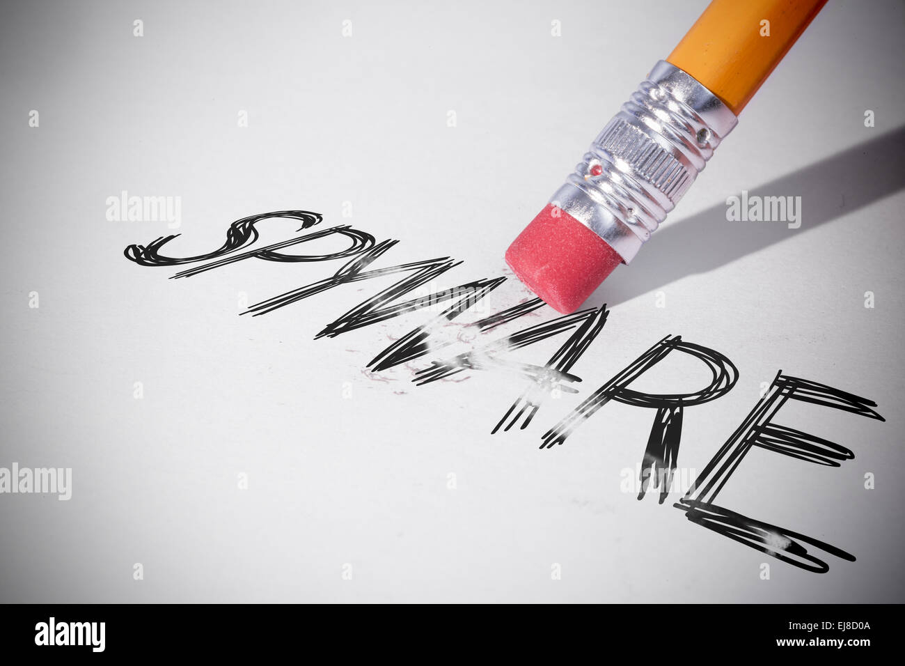 Pencil erasing the word Spyware Stock Photo - Alamy