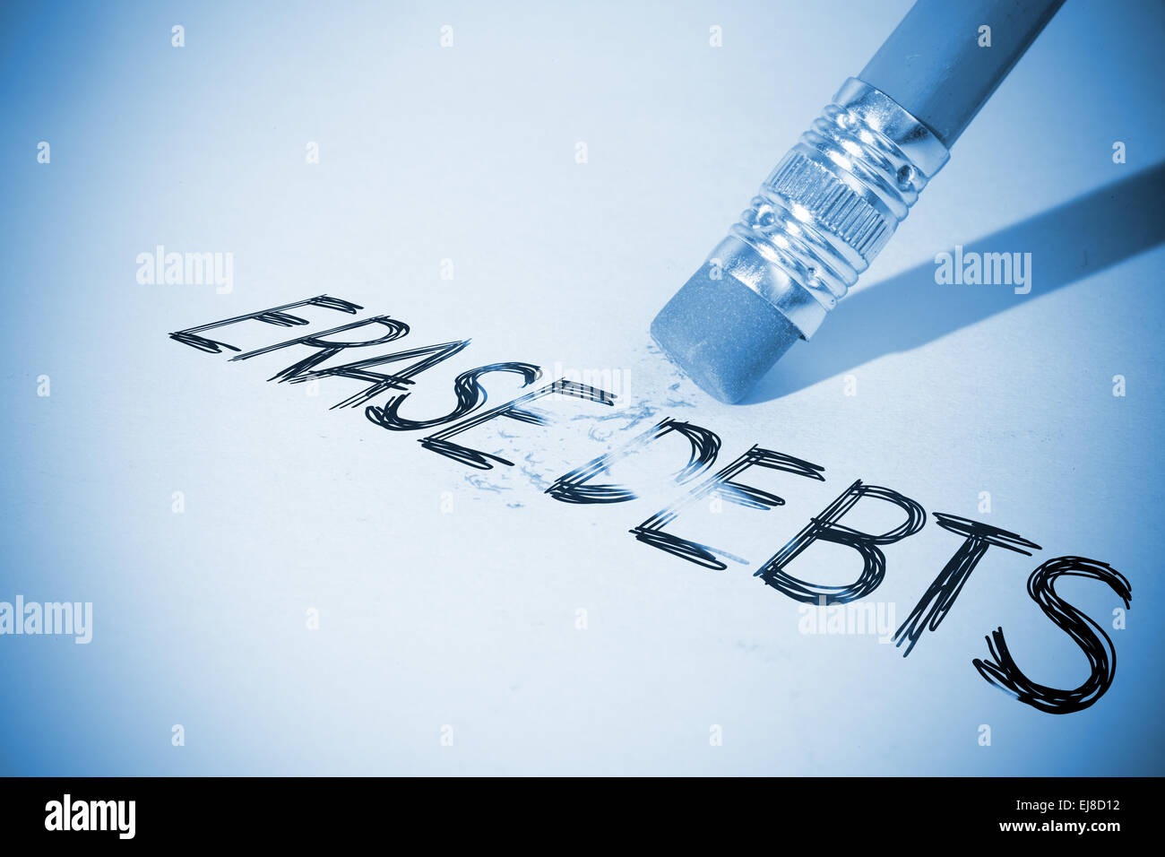 Pencil erasing the word Erase debts Stock Photo - Alamy