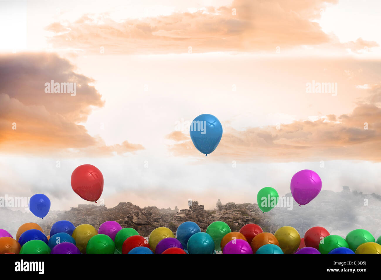 Many colourful balloons above landscape Stock Photo - Alamy