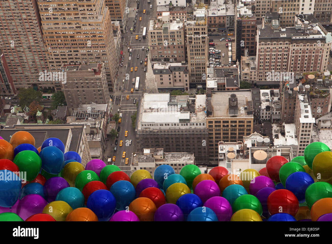 Many colourful balloons above city Stock Photo - Alamy