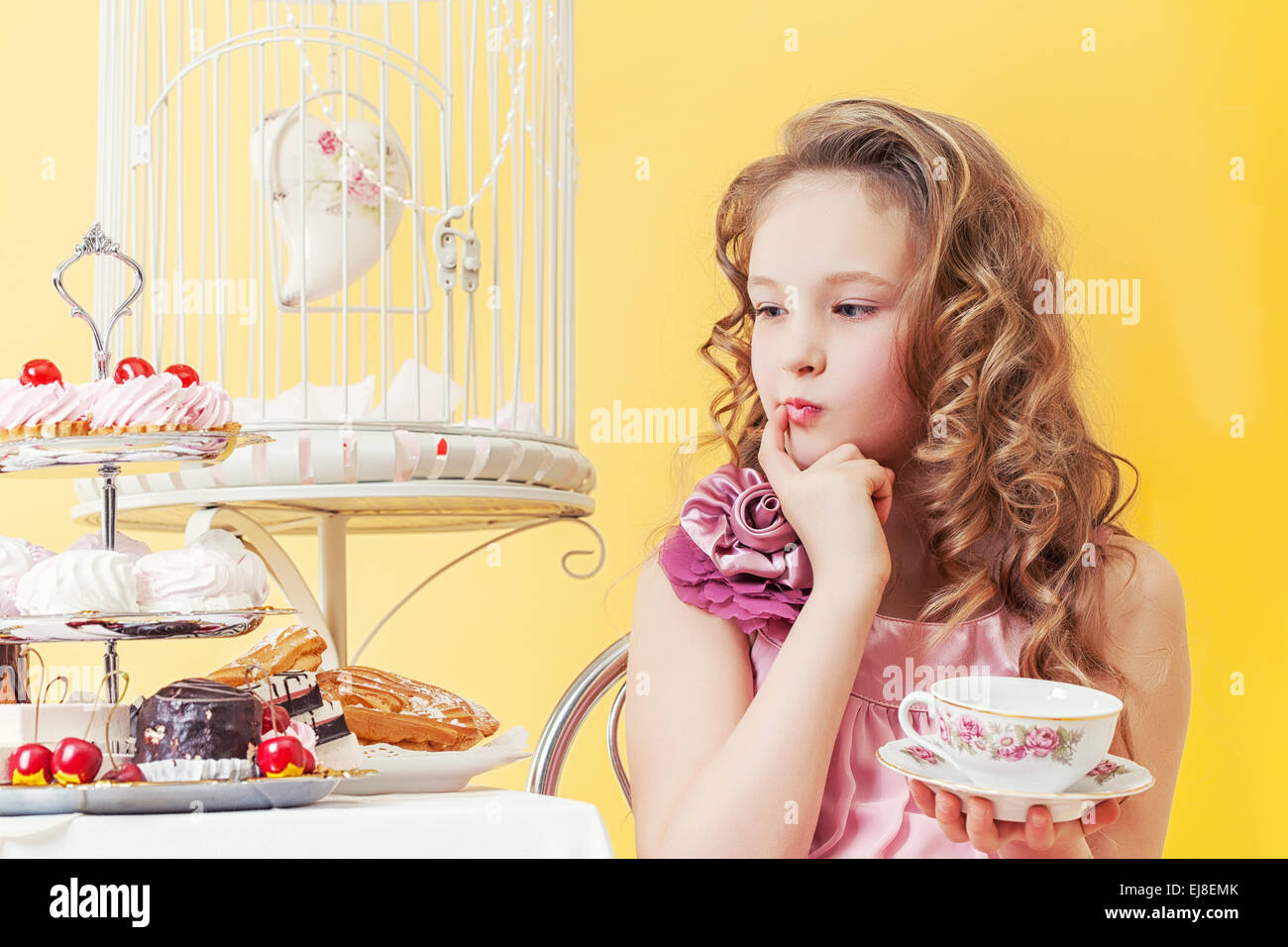 Fancy sweet tooth drinking tea in studio Stock Photo - Alamy