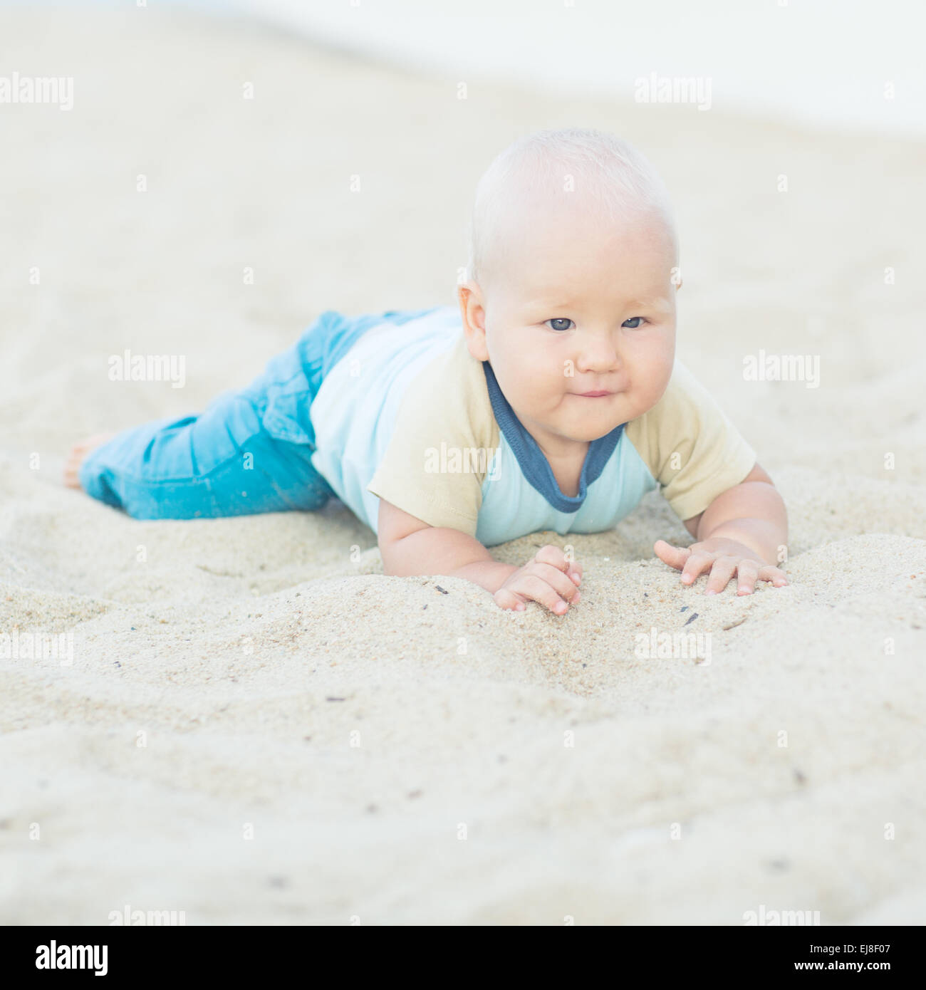 Baby on the beach Stock Photo - Alamy