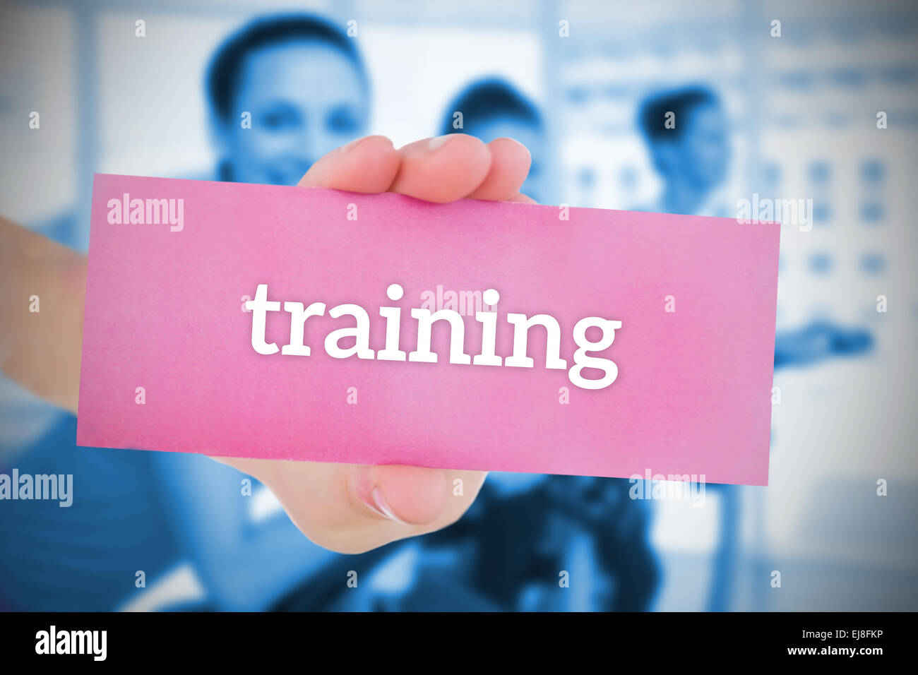 Woman holding pink card saying start against yoga class in gym Stock ...