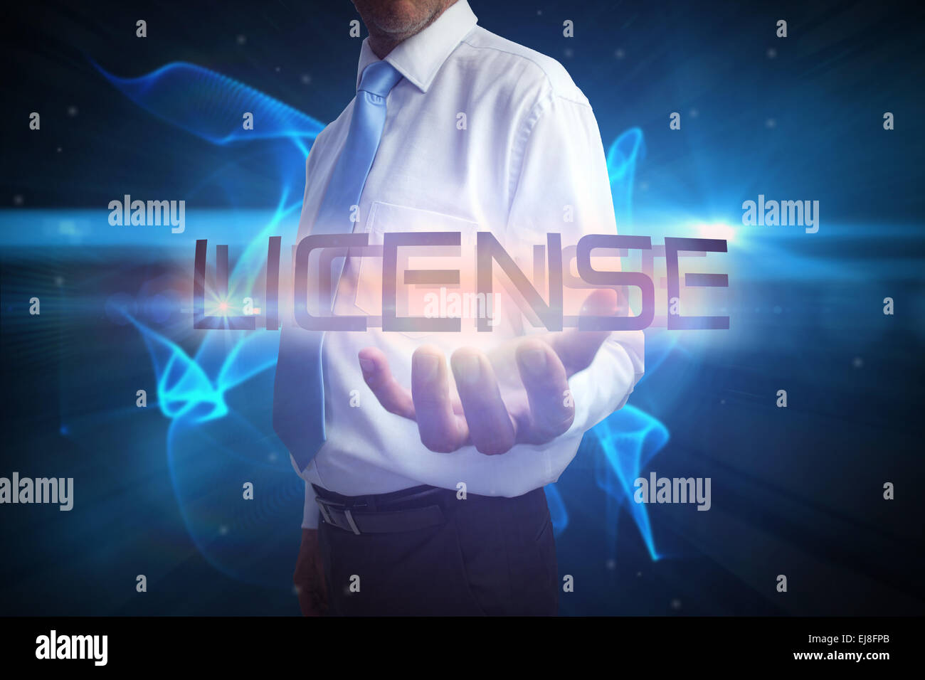 Businessman presenting the word license Stock Photo - Alamy