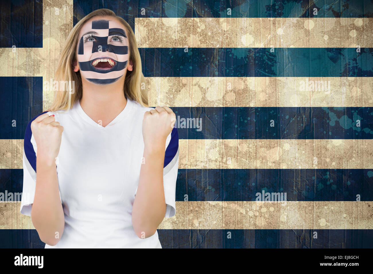 Excited greece fan in face paint cheering Stock Photo - Alamy