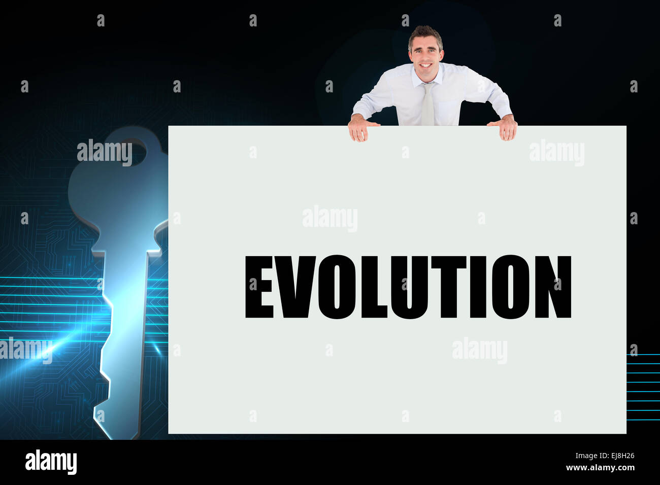 Businessman holding card saying evolution Stock Photo - Alamy