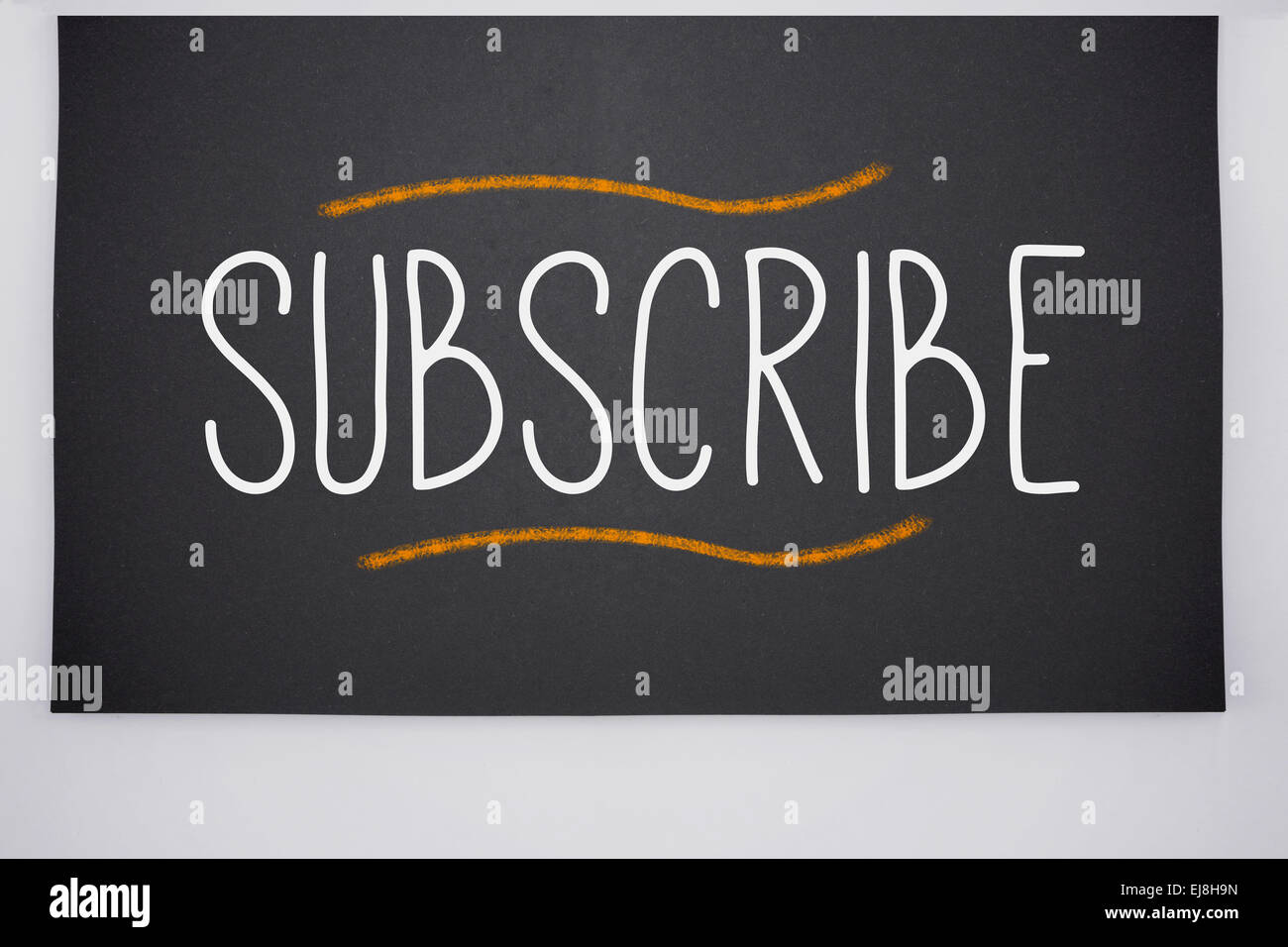 Subscribe written on big blackboard Stock Photo - Alamy