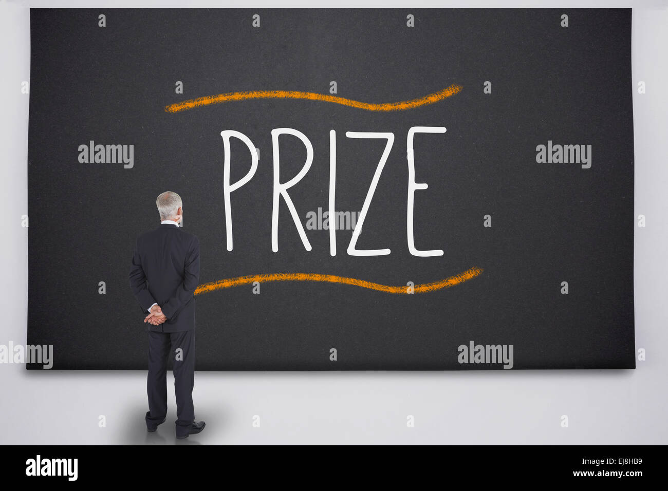 Businessman reading the word prize Stock Photo - Alamy