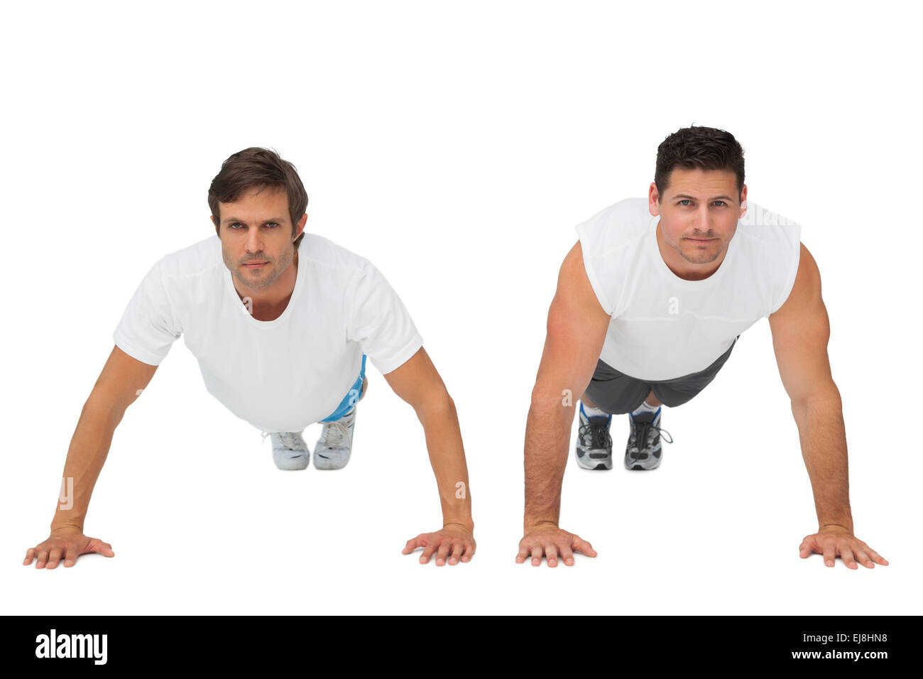 Portrait of two young men doing push ups Stock Photo - Alamy