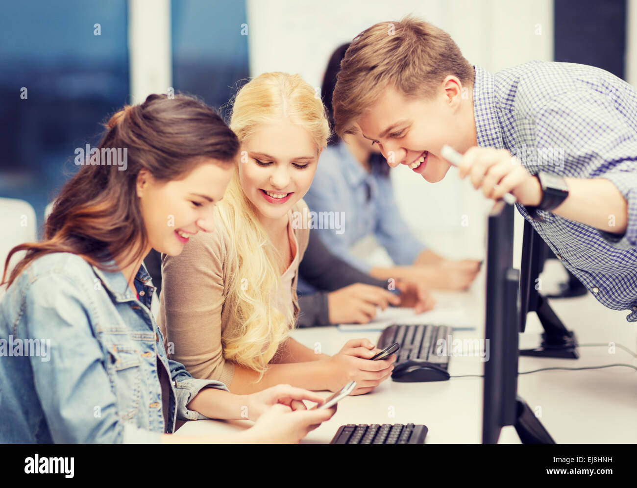 students with computer monitor and smartphones Stock Photo - Alamy