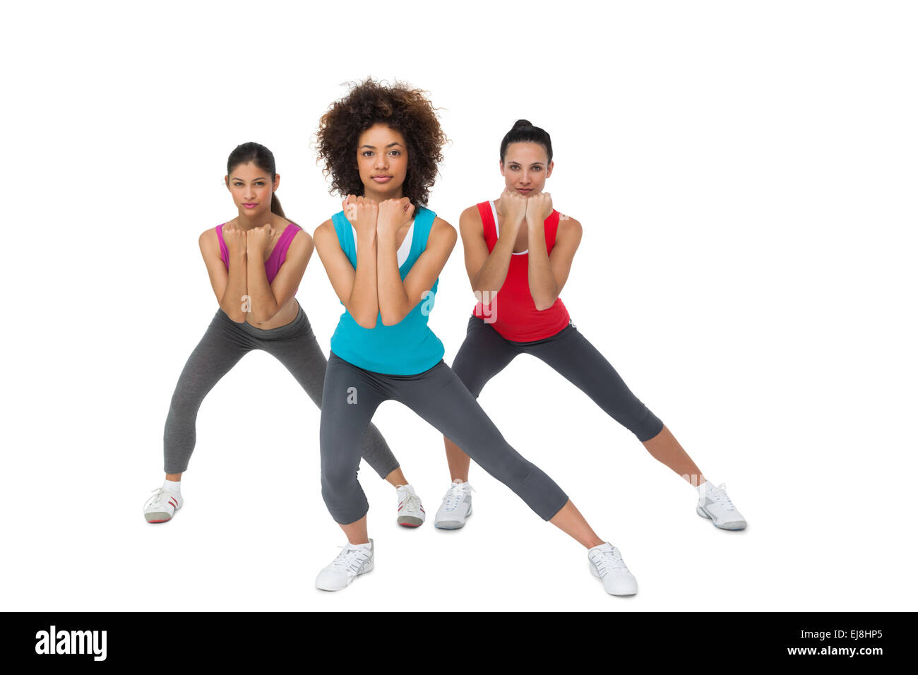 Full length portrait of women doing power fitness exercise Stock Photo ...