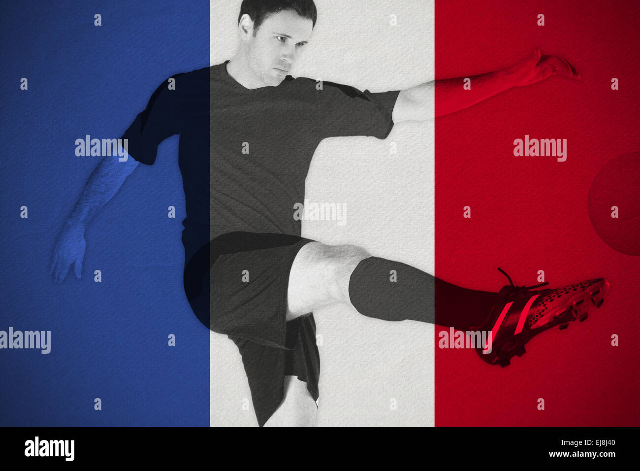 Football player in white kicking Stock Photo - Alamy