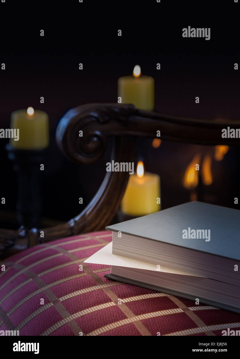 Envelope in book left on seat by fire Stock Photo - Alamy