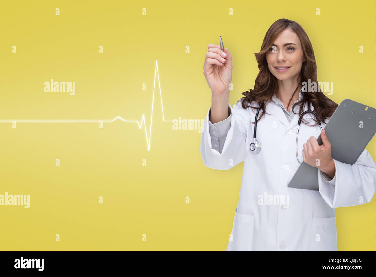 Composite image of smiling brunette doctor pointing Stock Photo - Alamy
