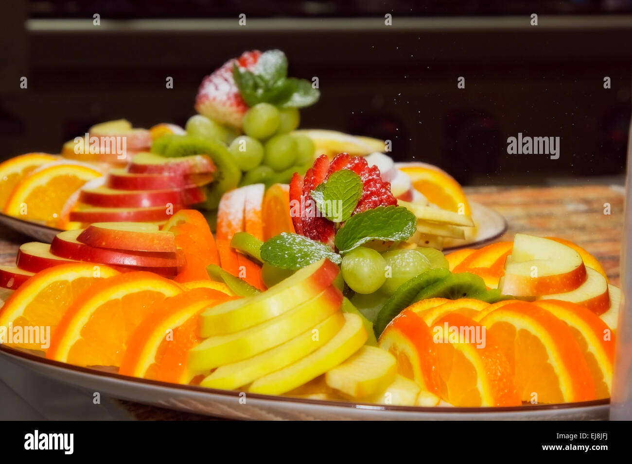 cutting fruits on plate. sweet food Stock Photo - Alamy