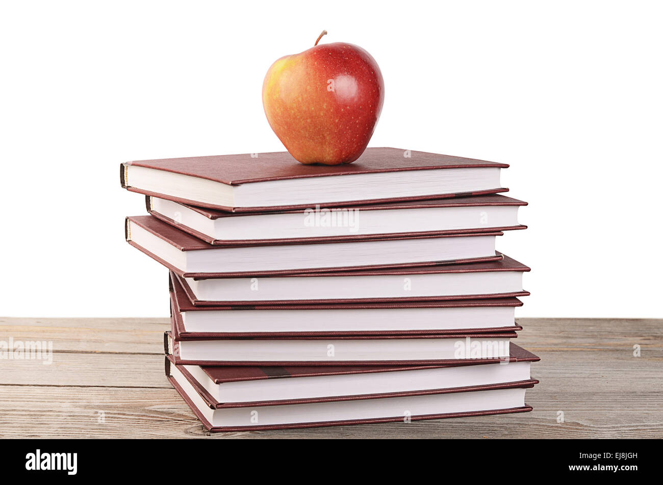 Book with apple isolated on white Stock Photo - Alamy