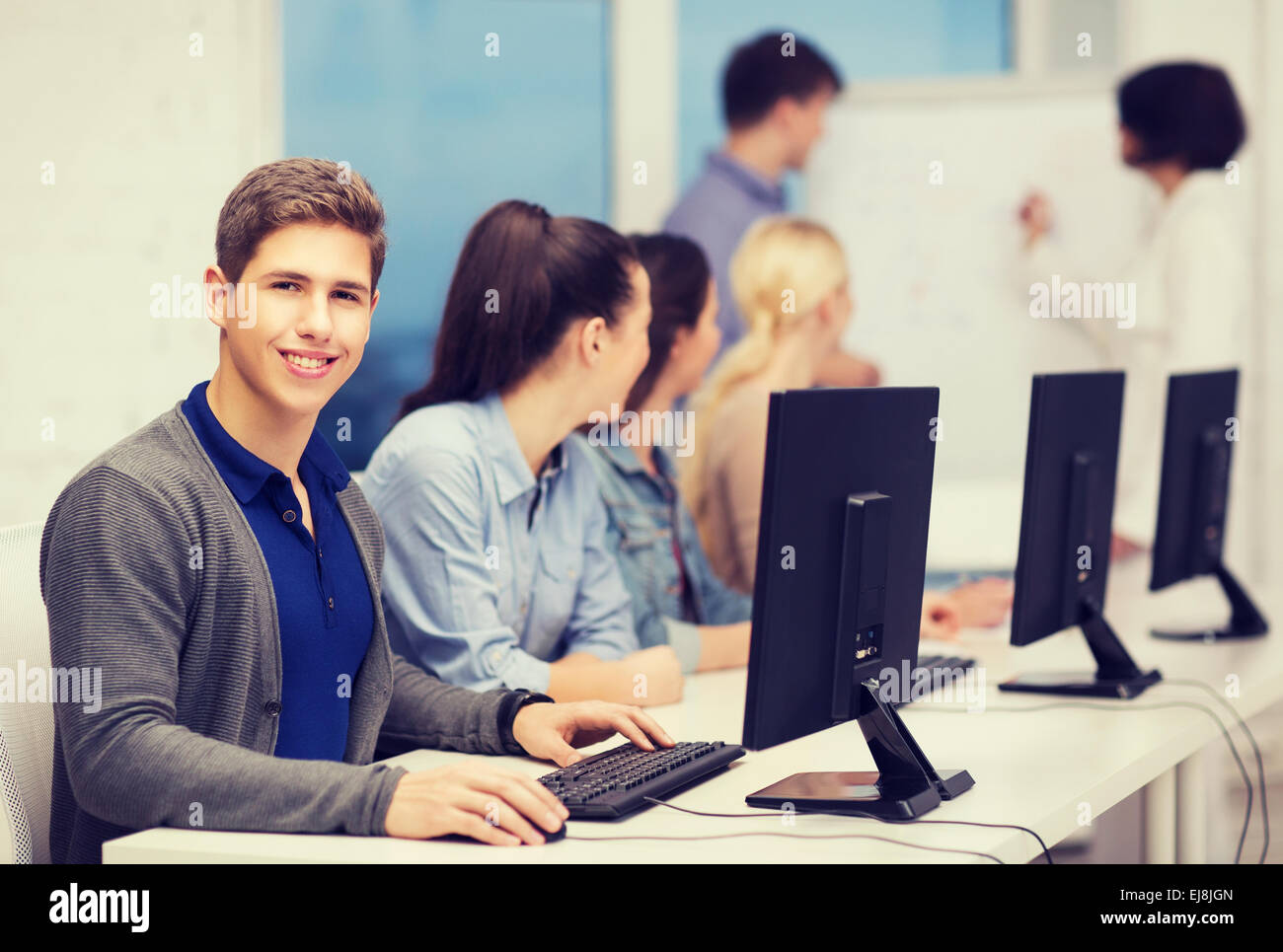 students with computer monitor at school Stock Photo - Alamy