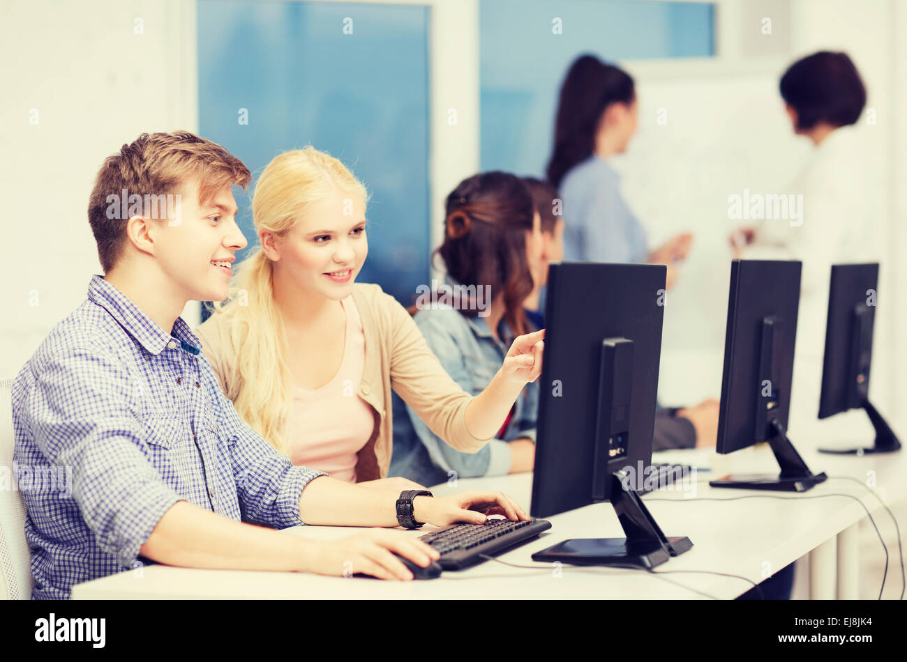 students with computer monitor at school Stock Photo - Alamy