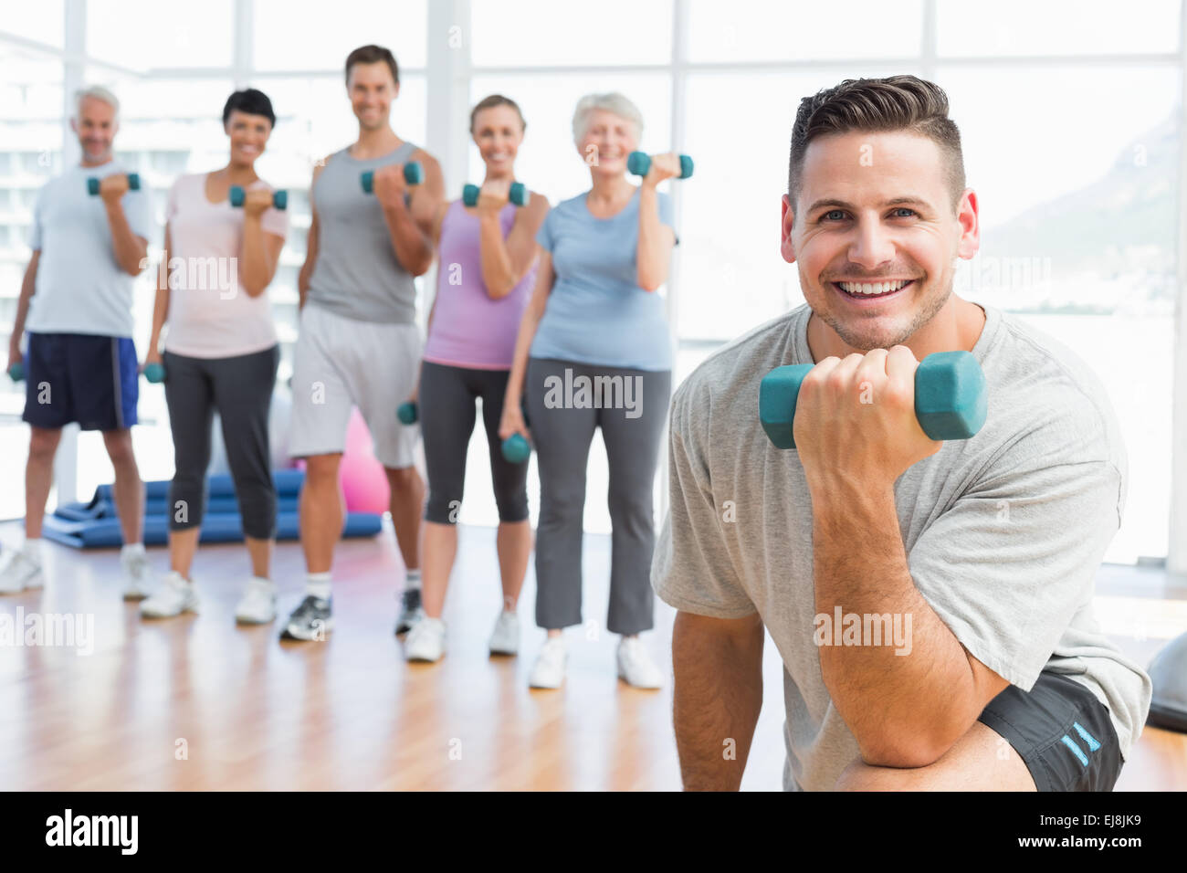 Fitness class holding dumbbells hi-res stock photography and images - Alamy