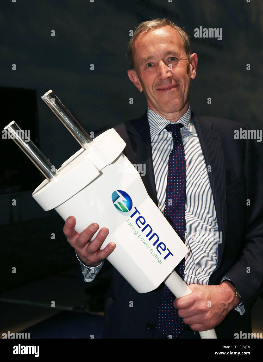 Mel Kroon, CEO of the network operator Tennet, poses with a plug during ...