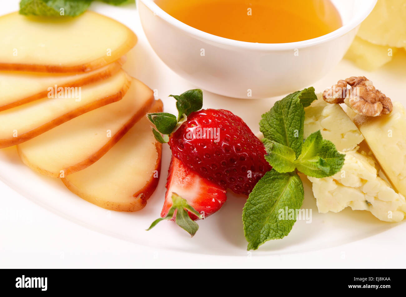 Assorted cheese with honey Stock Photo - Alamy