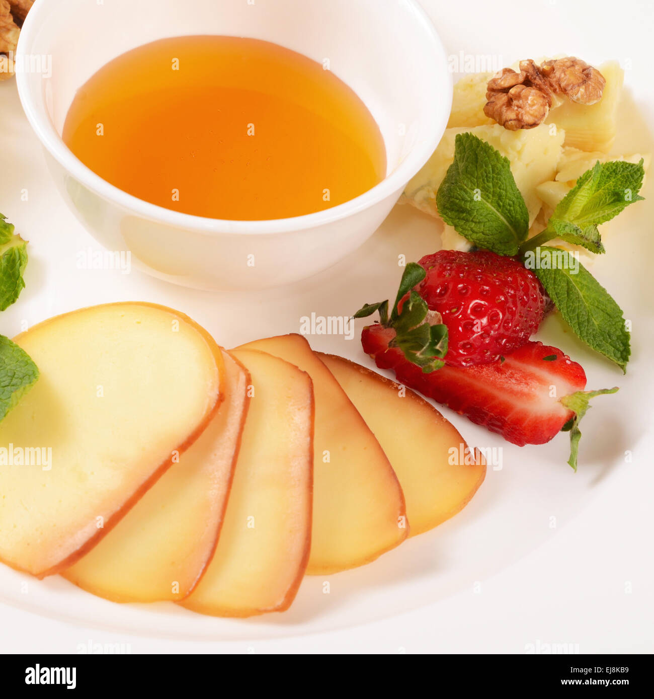 Assorted cheese with honey Stock Photo - Alamy