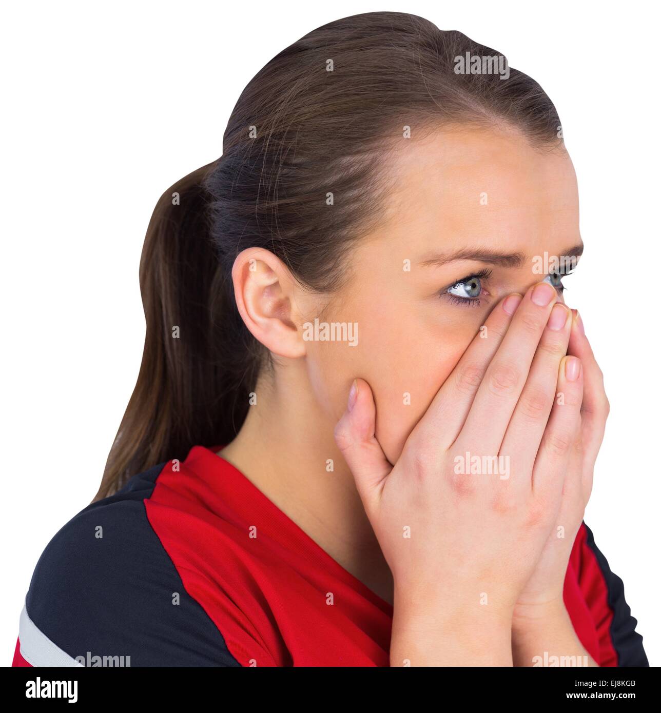 Nervous football fan in red on white background Stock Photo - Alamy