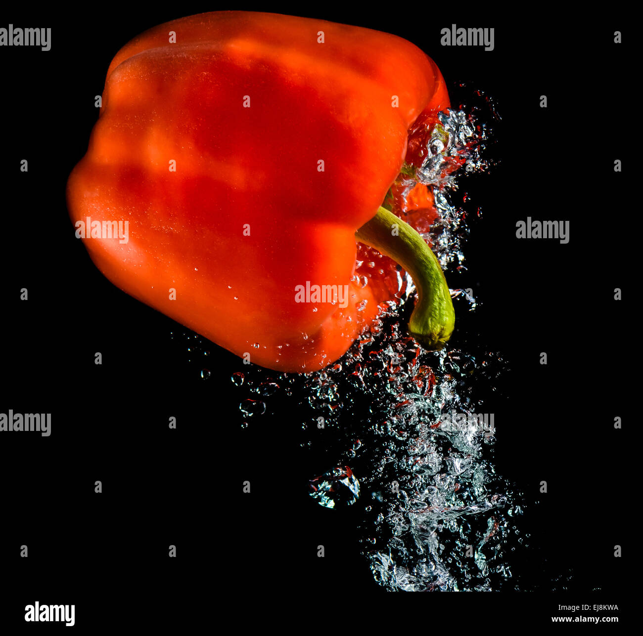 pepper dive into water Stock Photo - Alamy