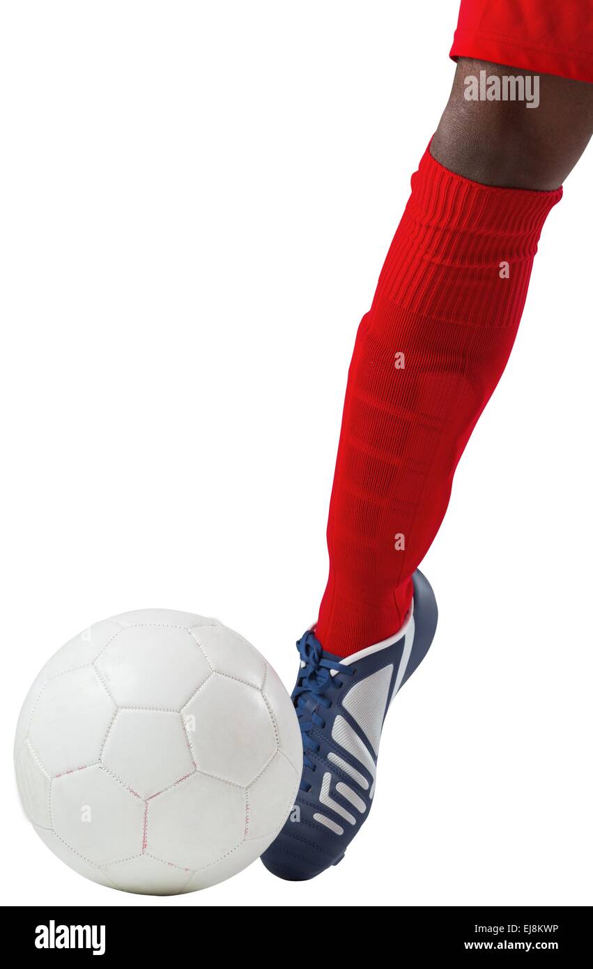 Football player kicking ball with boot Stock Photo - Alamy