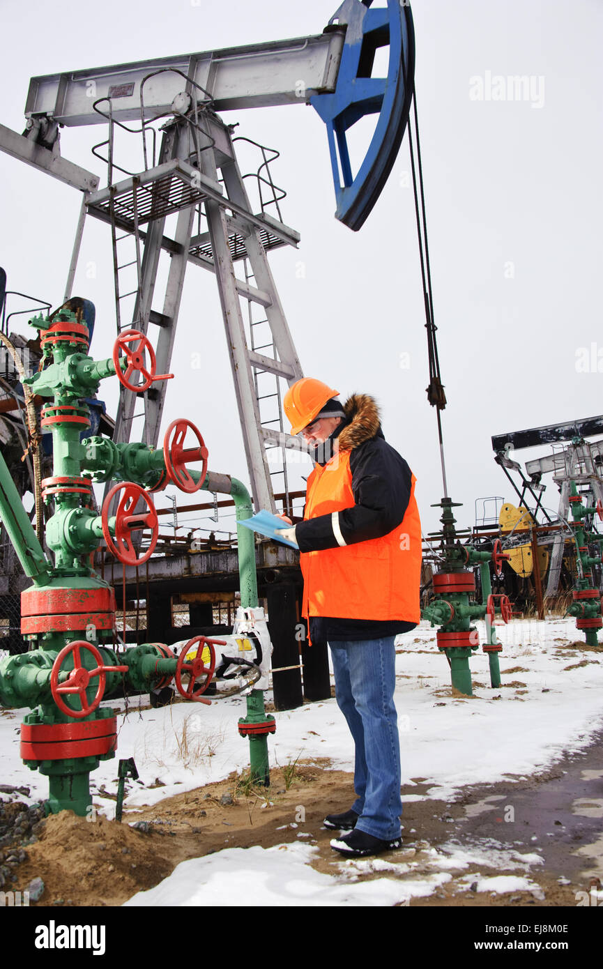 Worker in an oil field Stock Photo - Alamy