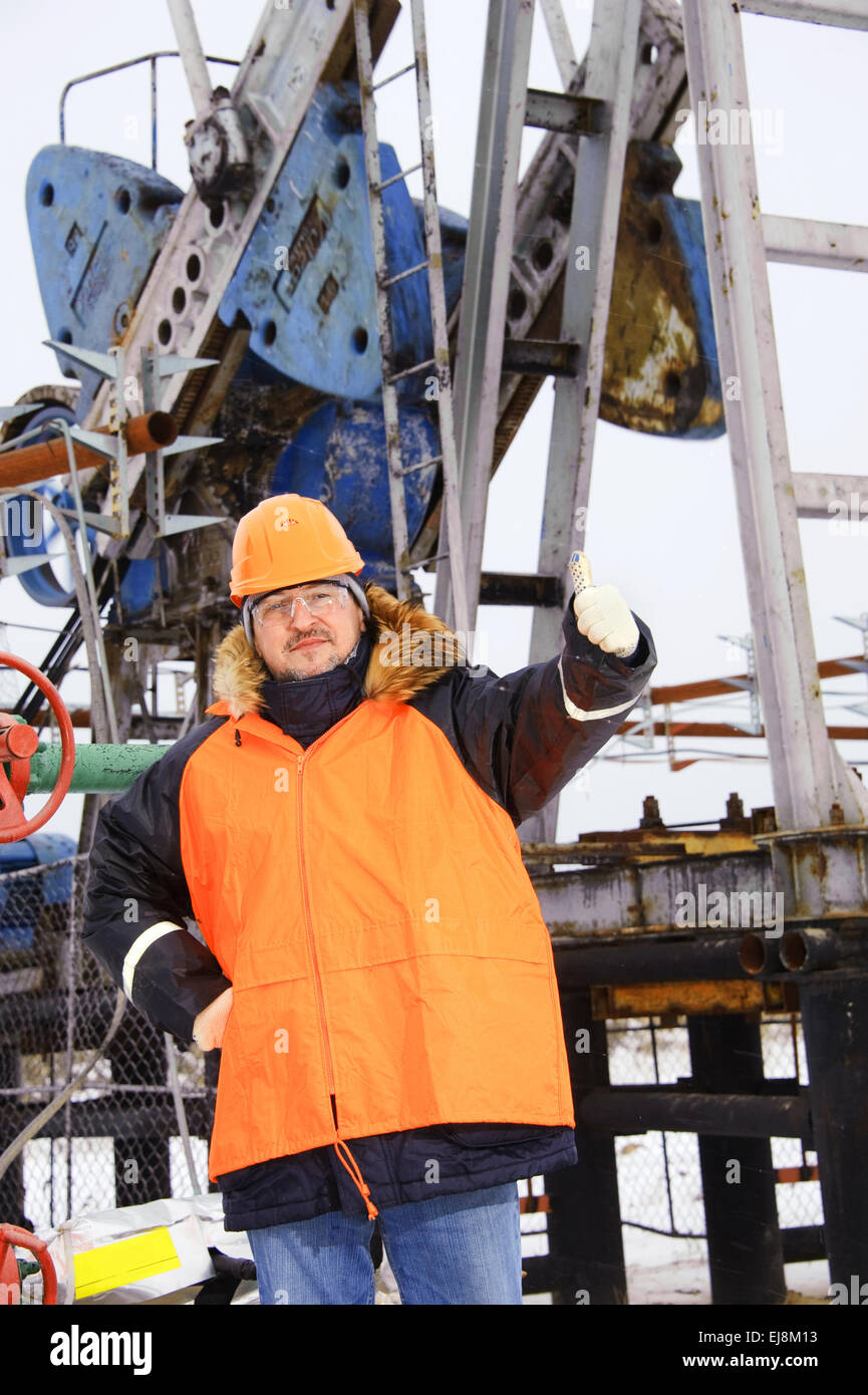 Worker in an oil field Stock Photo - Alamy