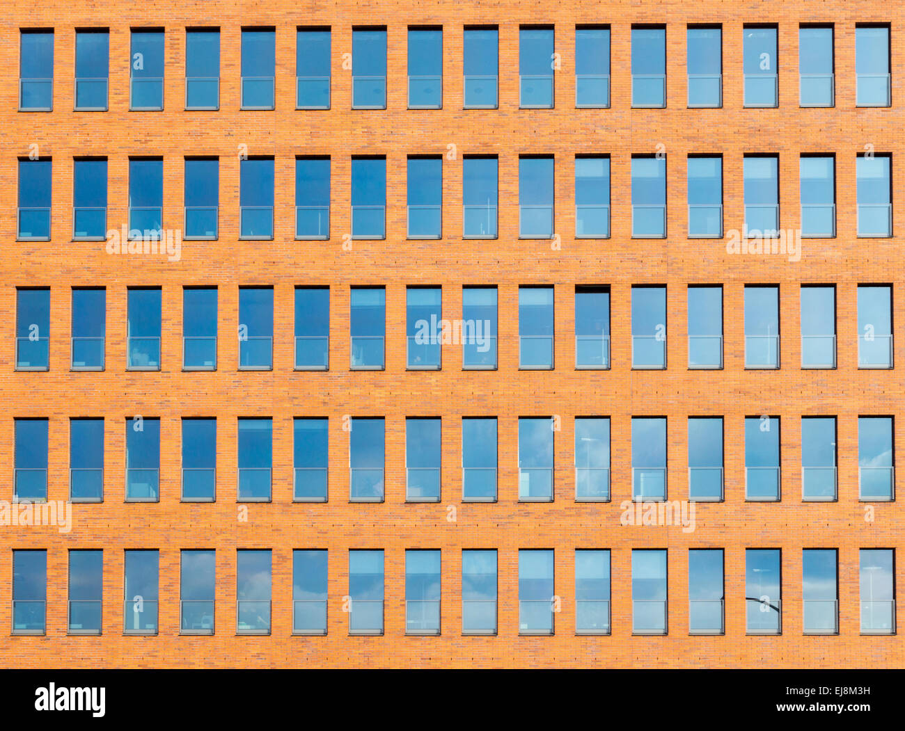 Orange brickwall with windows Stock Photo - Alamy