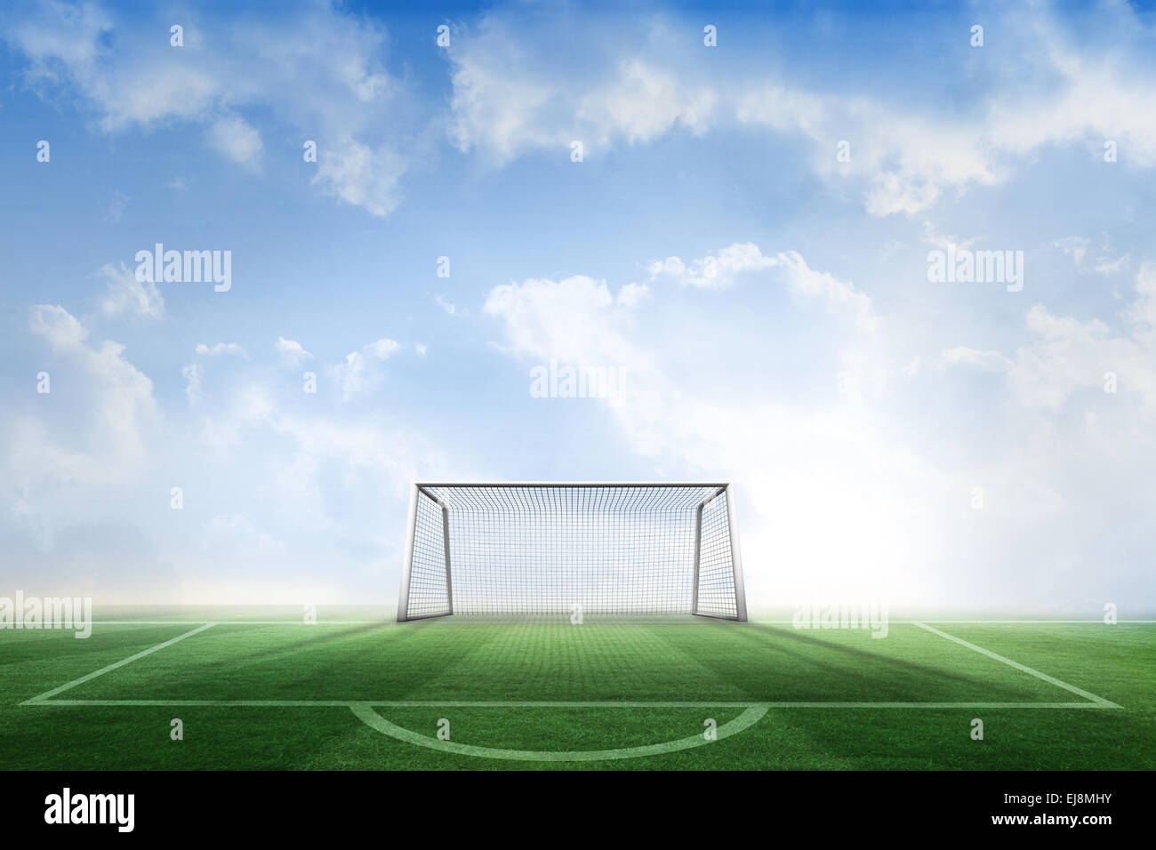 Football pitch and goal under blue sky Stock Photo - Alamy