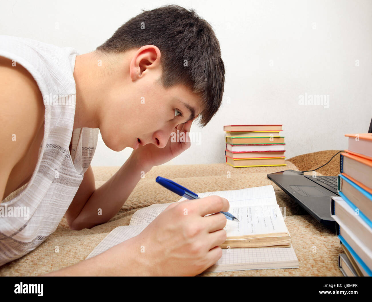 Teenager doing Homework Stock Photo - Alamy