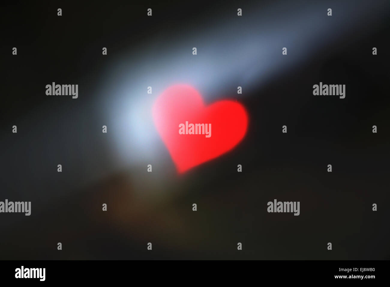Blurred background with red heart Stock Photo - Alamy
