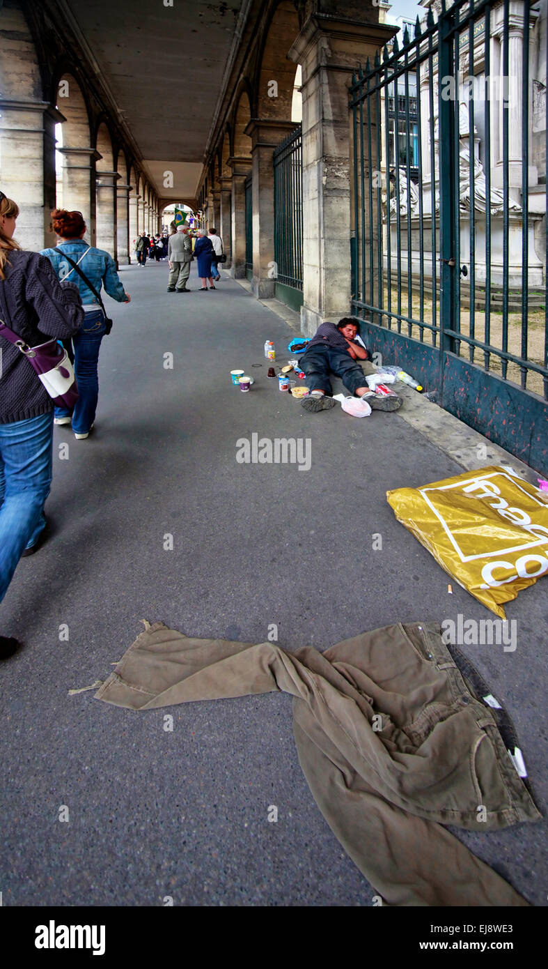 Paris, France - September 17, 2010: A homeless man lying on the ...