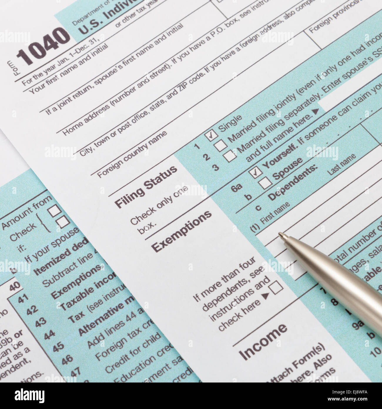 US 1040 Tax Form and silver ball pen Stock Photo - Alamy