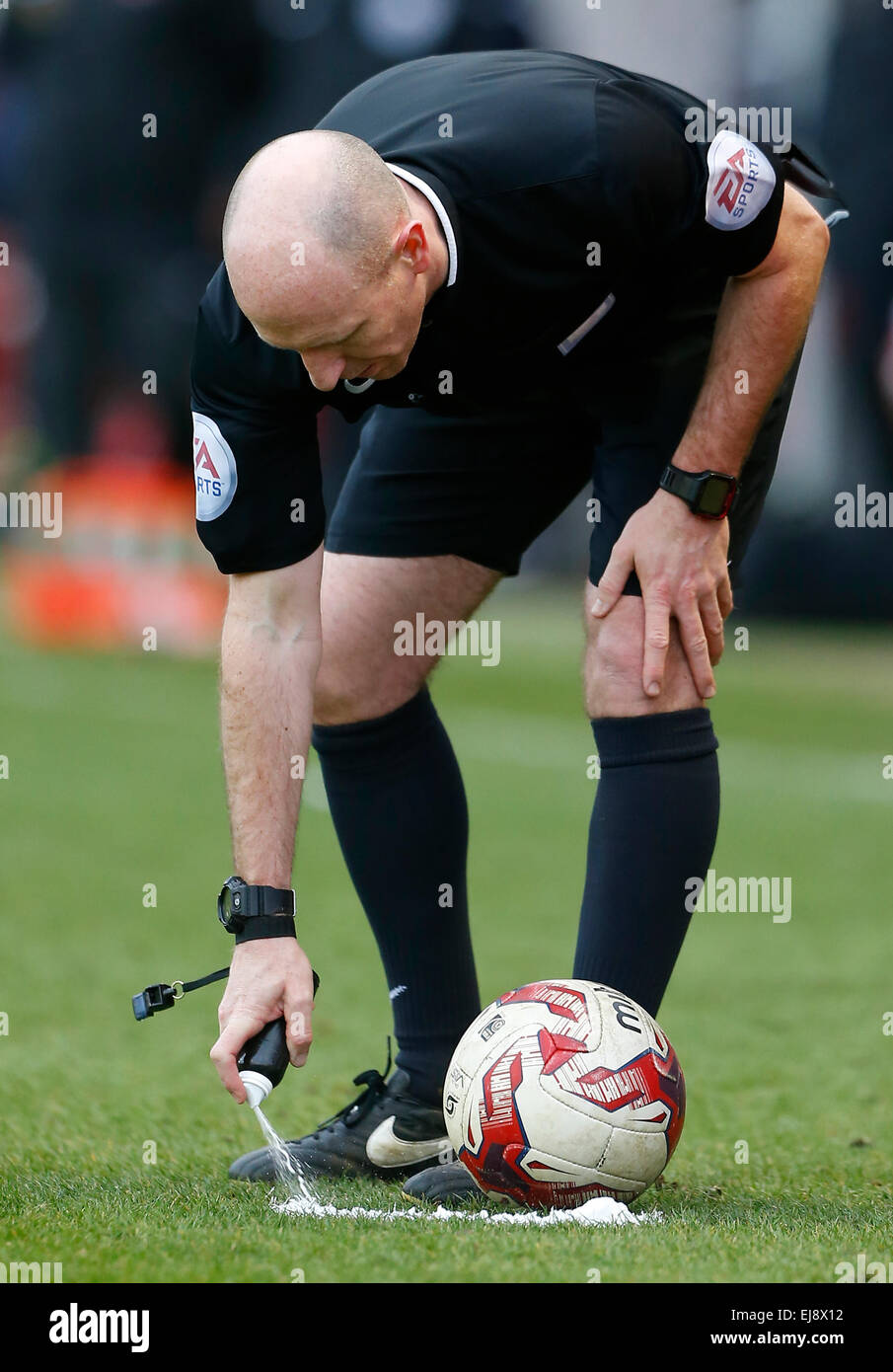 A referee marks the ball position with vanishing spray before a free ...
