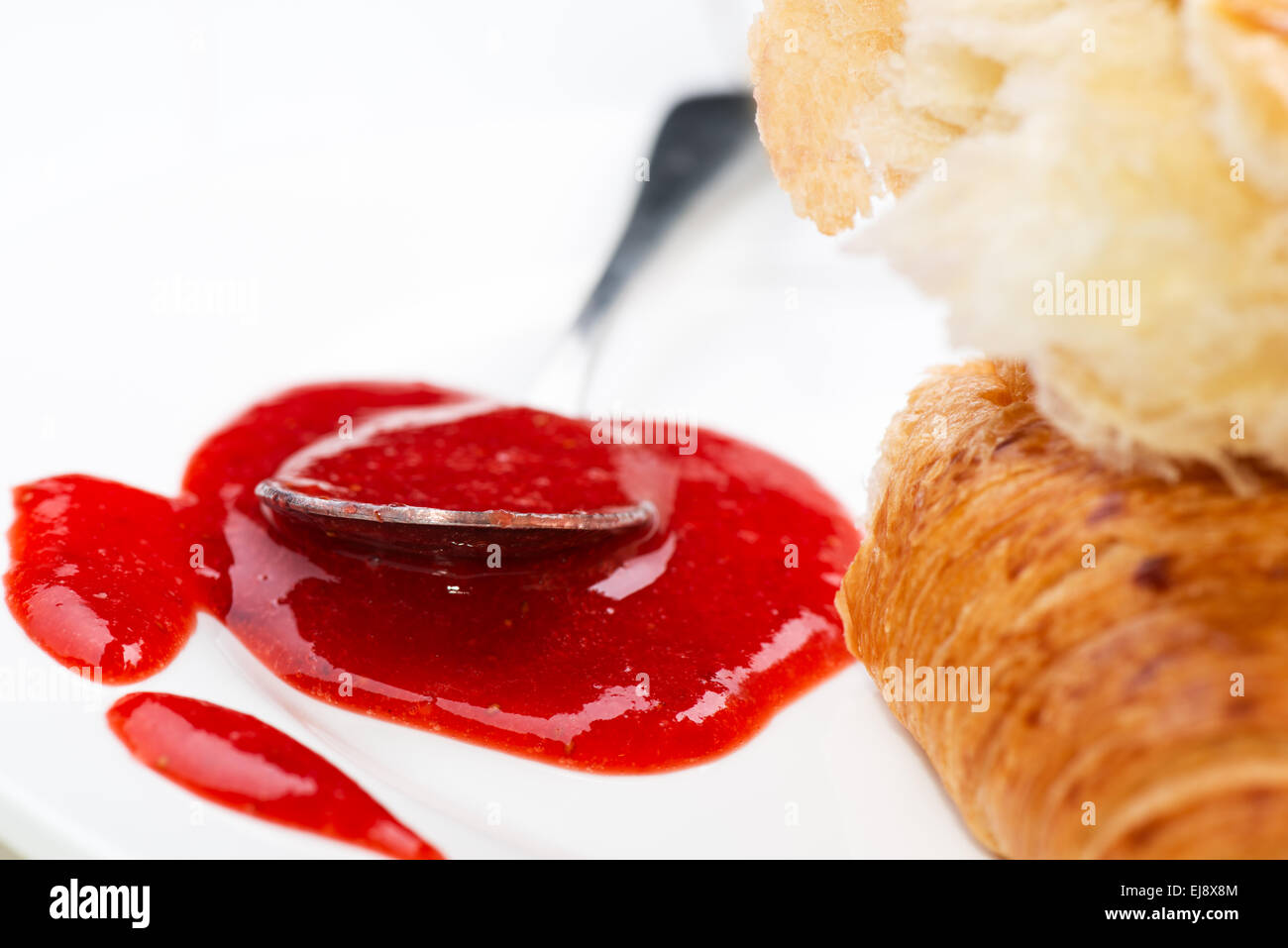 Close up strawberry jam and croissant Stock Photo - Alamy