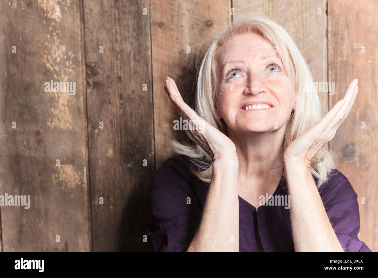 senior woman wood background Stock Photo - Alamy
