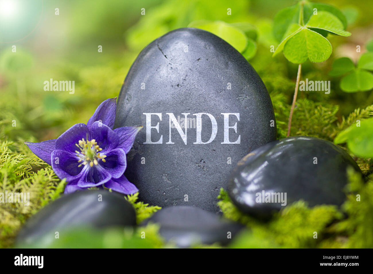 Black stone with the Word „Ende“ Stock Photo - Alamy