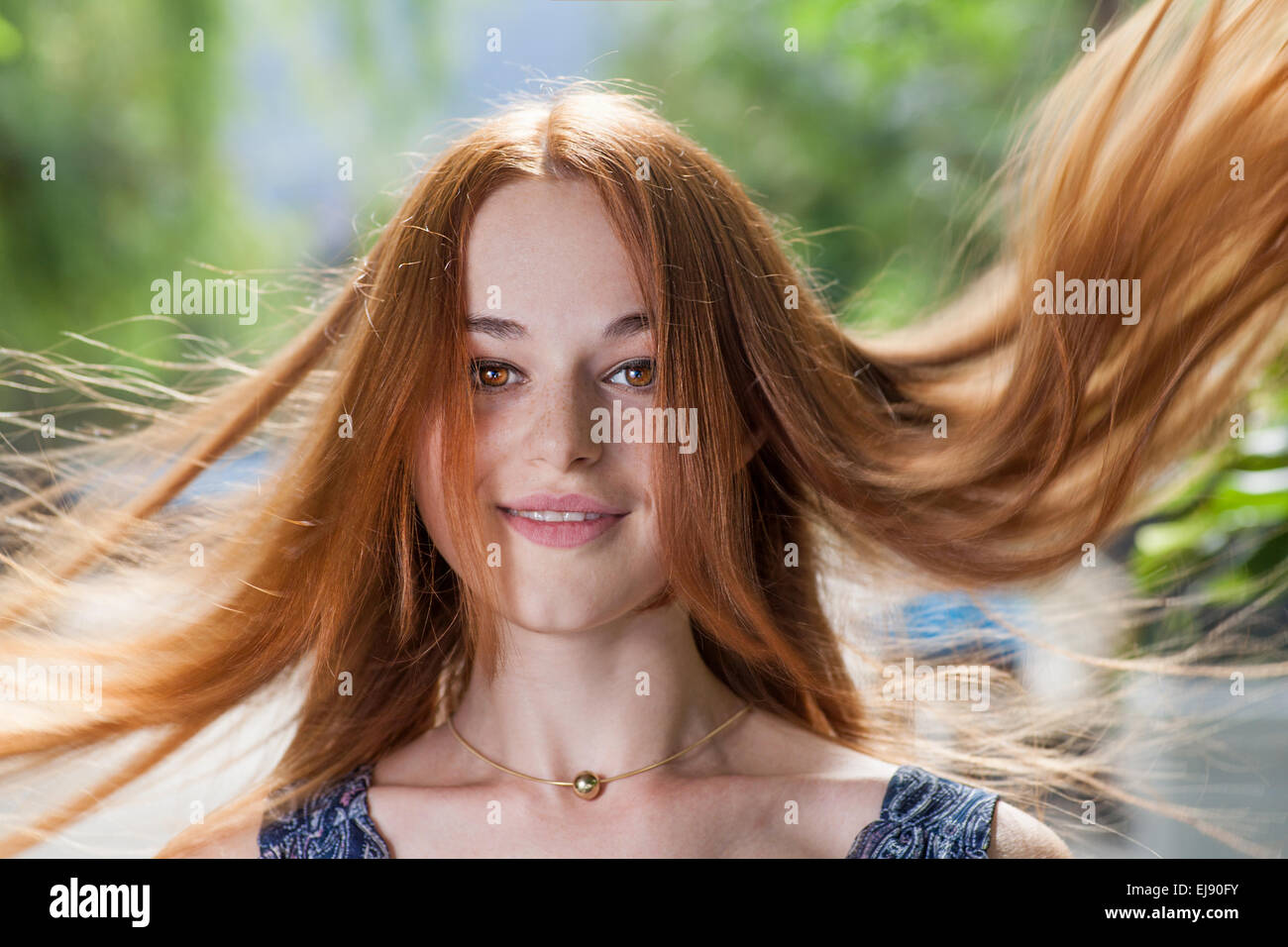 Red hair flying by wind Stock Photo - Alamy